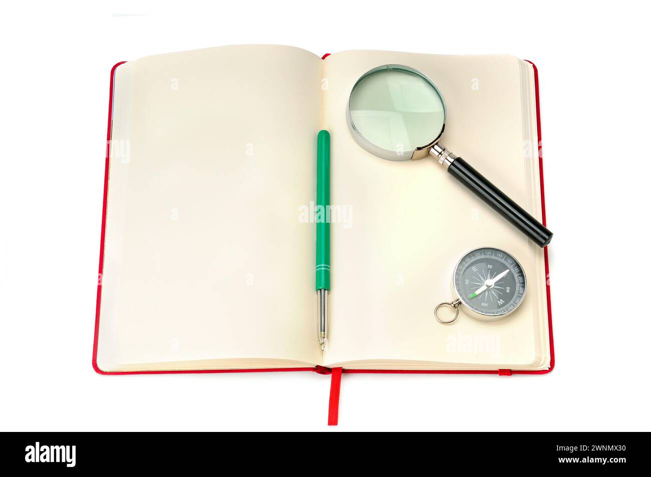 Open notebook with compass, magnifying glass and free space for text ...