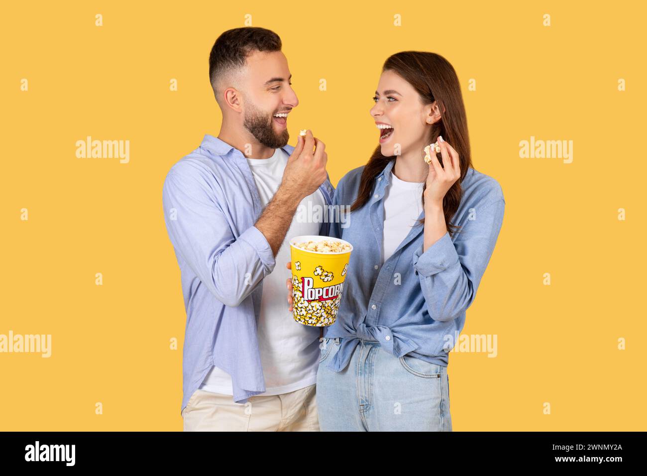 Sharing popcorn cinema hi-res stock photography and images - Alamy