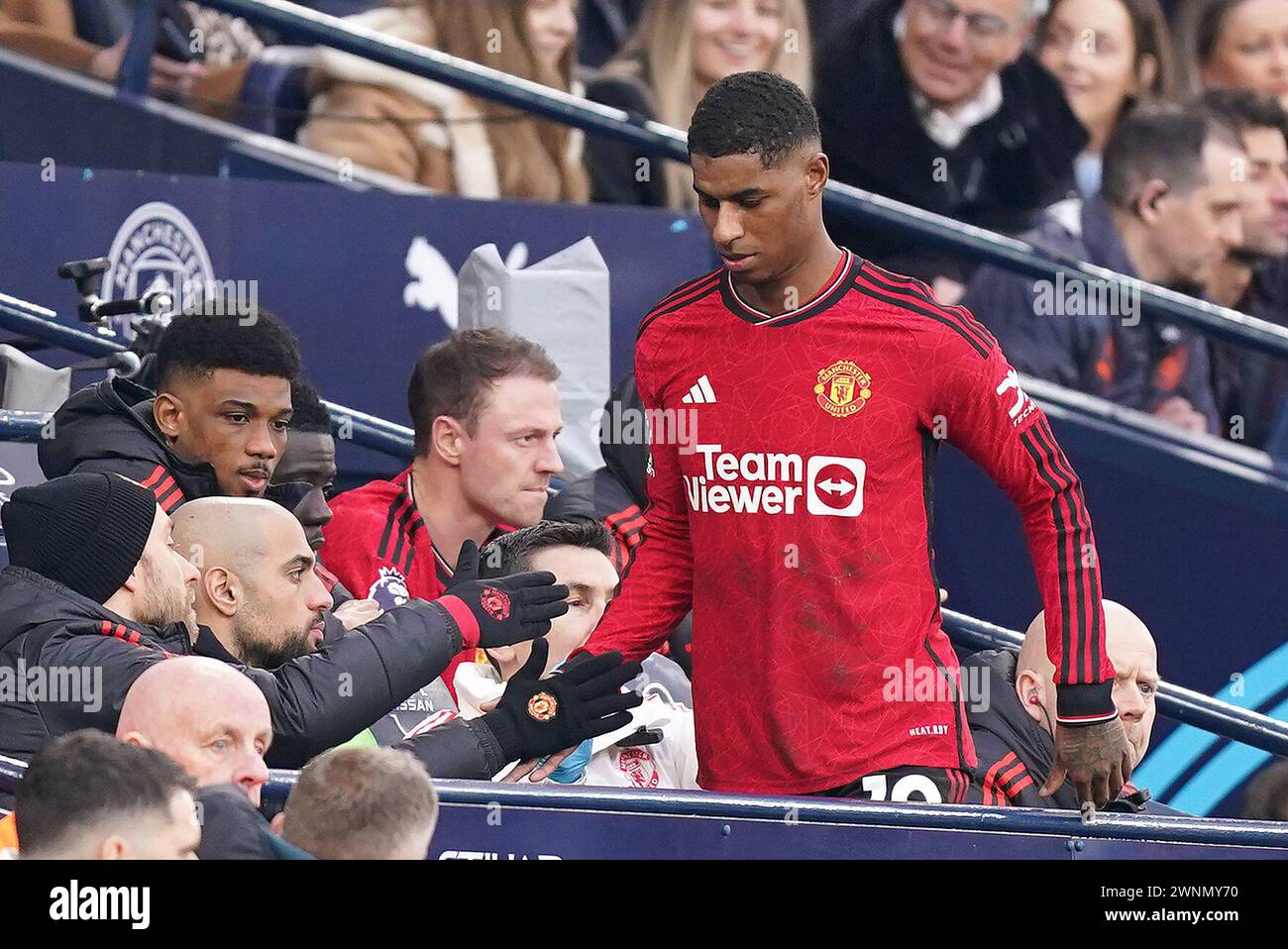 Manchester United's Marcus Rashford take their place on the bench after ...