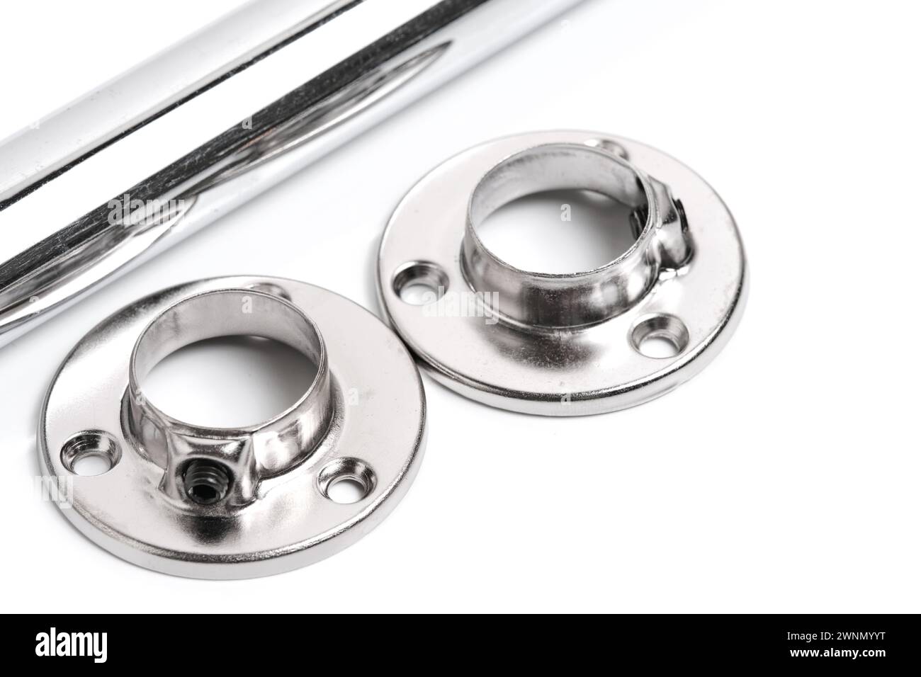 Nickel plated tube and two flanges for its attachment, white background ...