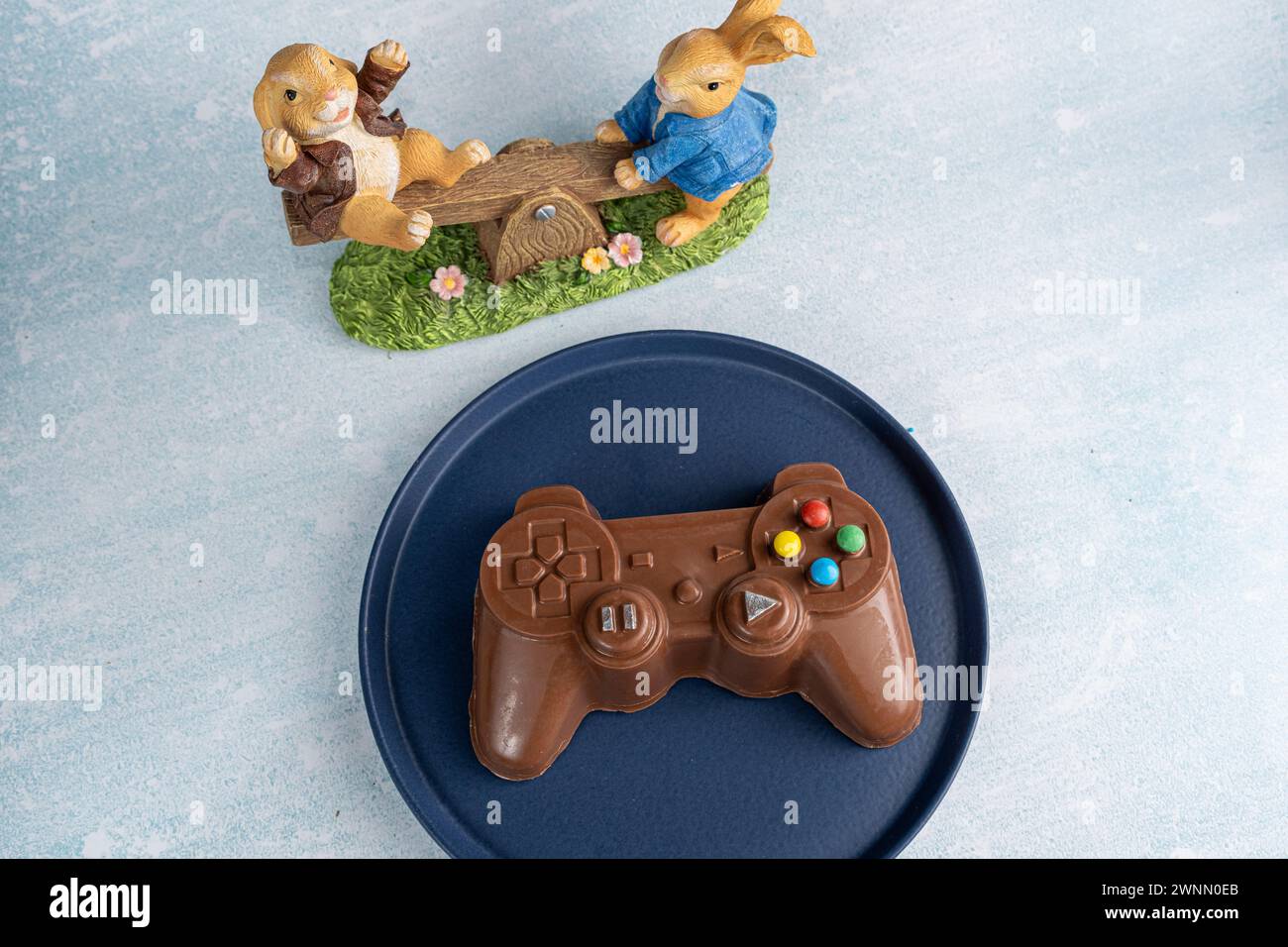 Milk chocolate in the shape of a video game controller alongside small ...