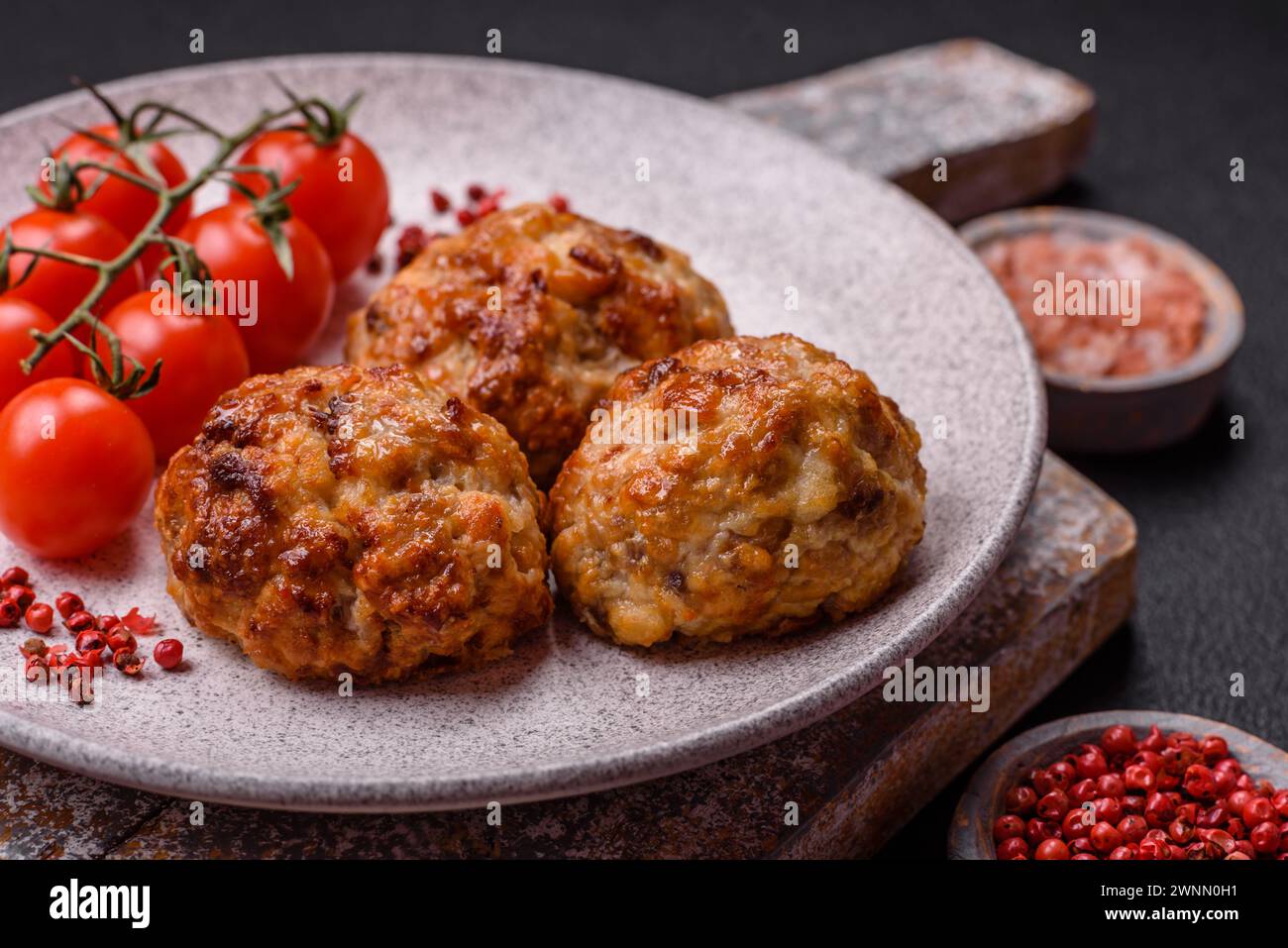 Delicious fresh fried minced fish cutlets with spices and herbs on a ...