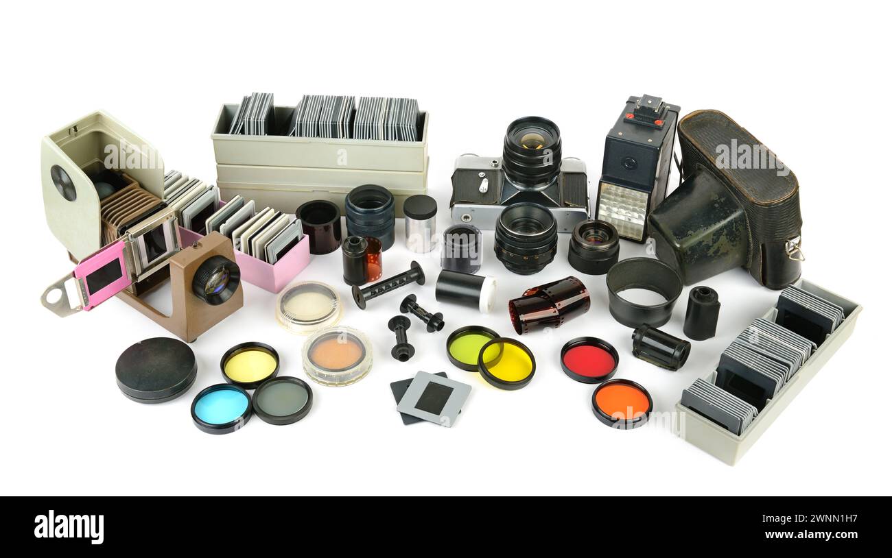 Retro camera and slide projector with accessories isolated on white ...