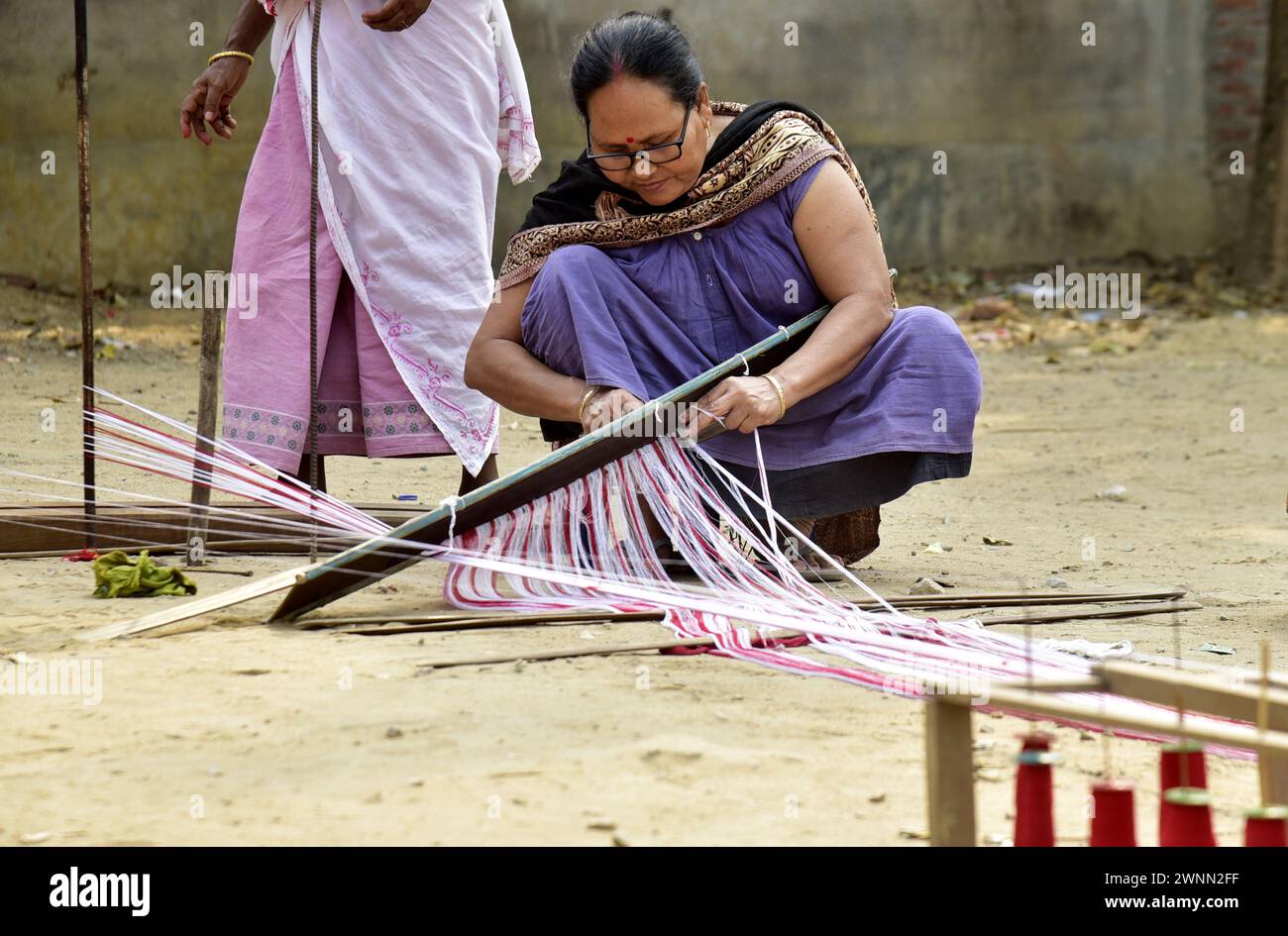Guwahati, Guwahati, India. 3rd Mar, 2024. Weaver preparing to make ...