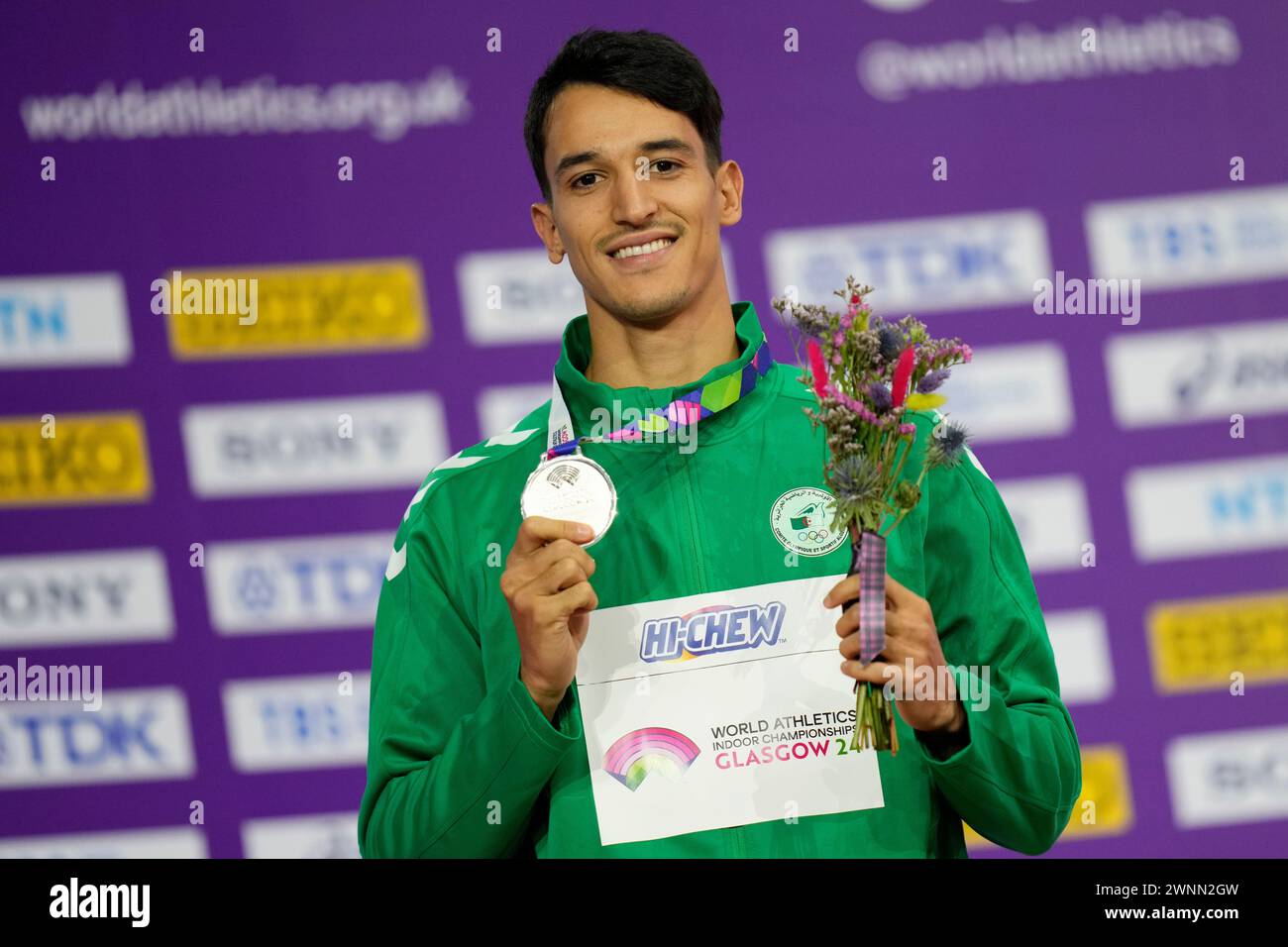 Yasser Mohammed Triki, of Algeria, poses on the podium after winning ...