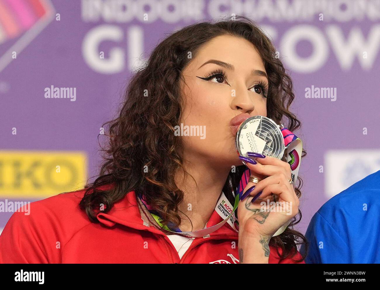 Poland's Ewa Swoboda kisses her silver medal on the podium for the ...
