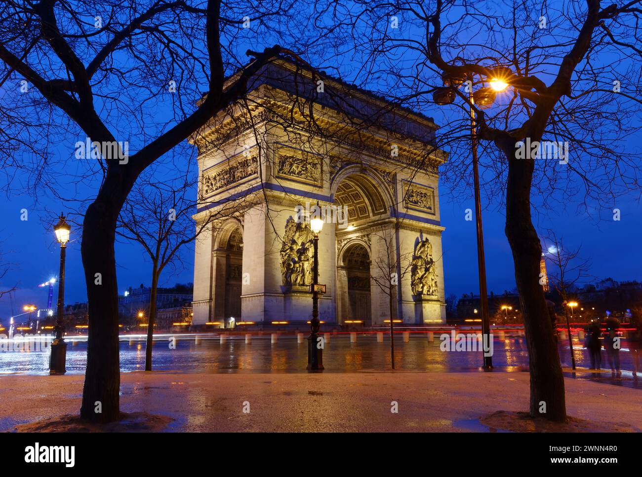 The Triumphal Arch in rainy evening. It is one of the most famous ...