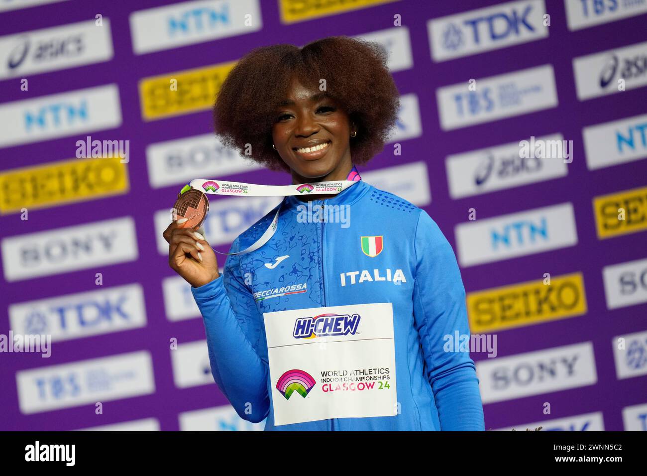 Zaynab Dosso, of Italy, poses on the podium after winning the bronze ...