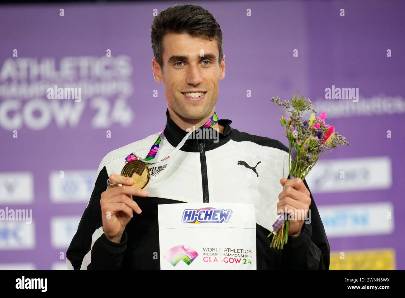 Hamish Kerr, of New Zealand, poses on the podium after winning the gold ...