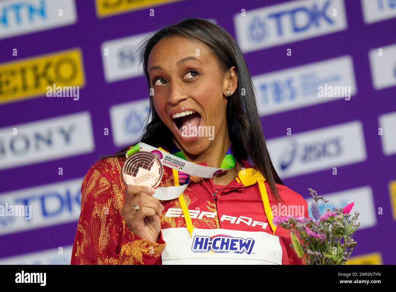 Ana Peleteiro-Compaore, of Spain, poses on the podium after winning the ...