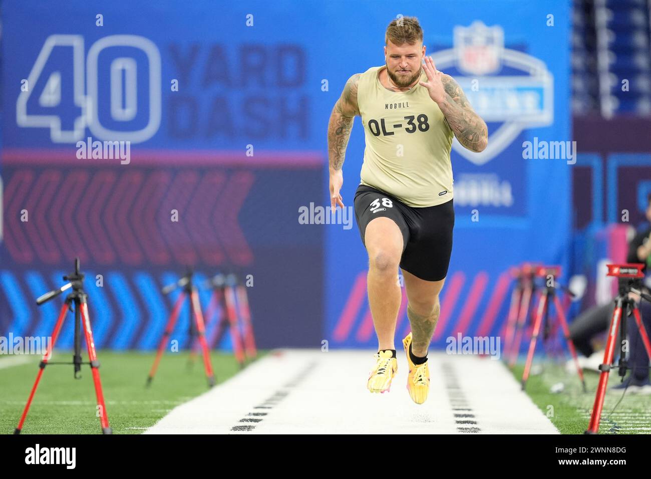 Michigan offensive lineman Trevor Keegan runs the 40-yard dash at the ...