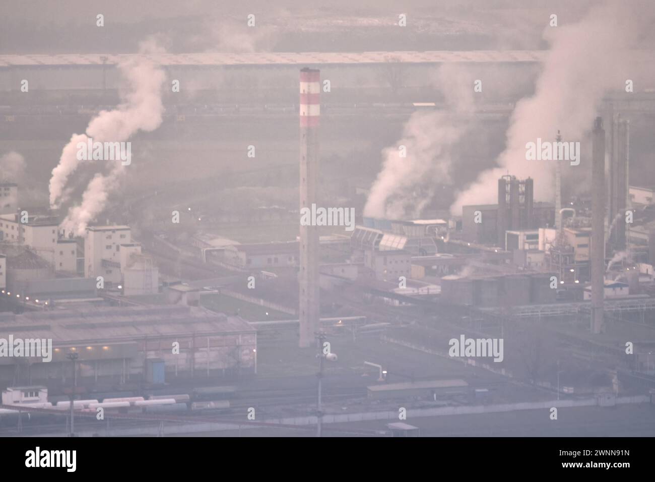 Lovosice, Czechia–Feb 16, 2024: Chemical plant factory smoke stacks ...