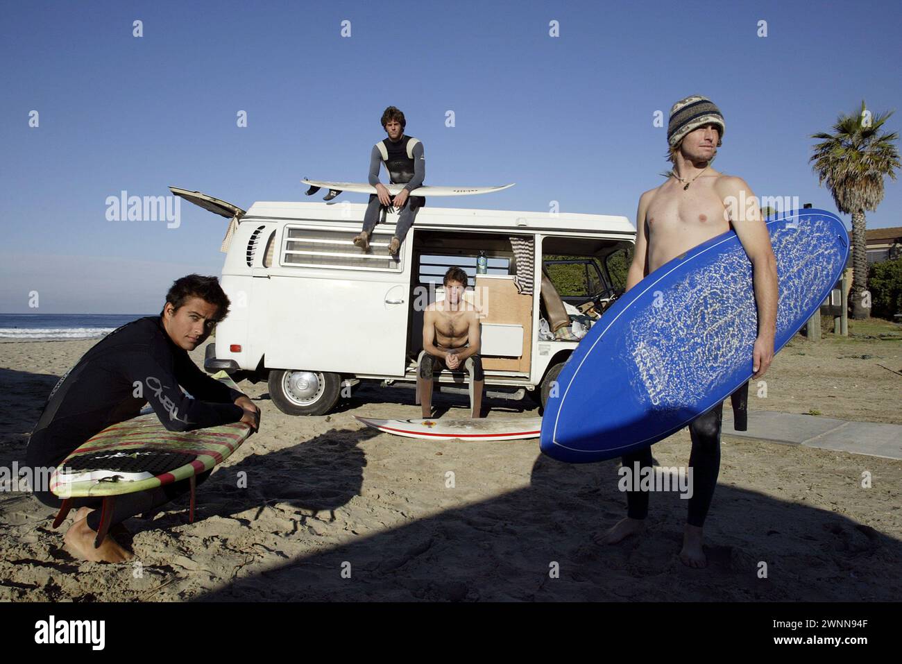 SURFERS- (L-R) Mike Kalish ( black Xcel wetsuit), twin brother Charlie Kalish (brown wetsuit ...