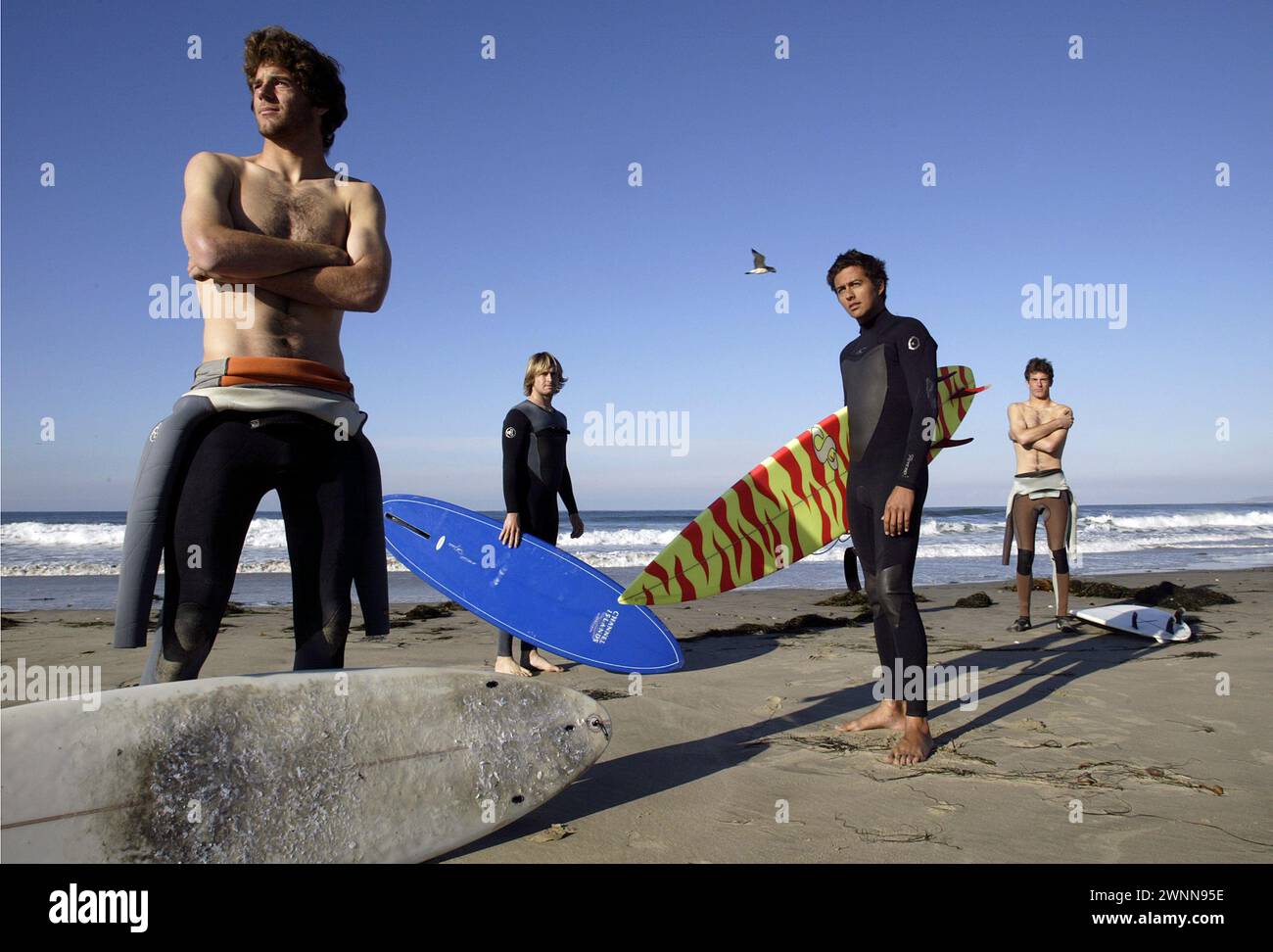 SURFERS- (L-R) Mike Kalish ( black Xcel wetsuit), twin brother Charlie Kalish (brown wetsuit ...