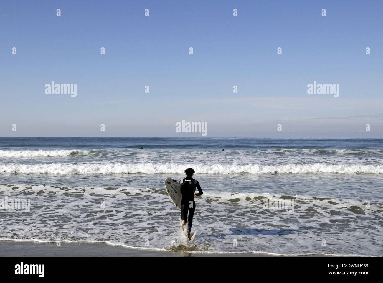 SURFERS- (L-R) Mike Kalish ( black Xcel wetsuit), twin brother Charlie ...