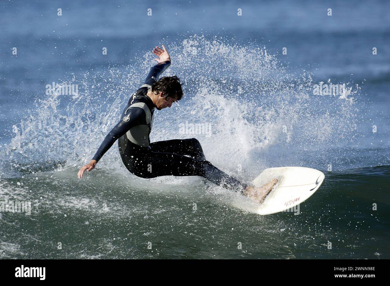 SURFERS- (L-R) Mike Kalish ( black Xcel wetsuit), twin brother Charlie ...