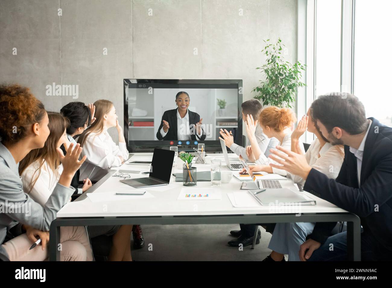 Business team waving hands office hi-res stock photography and images ...