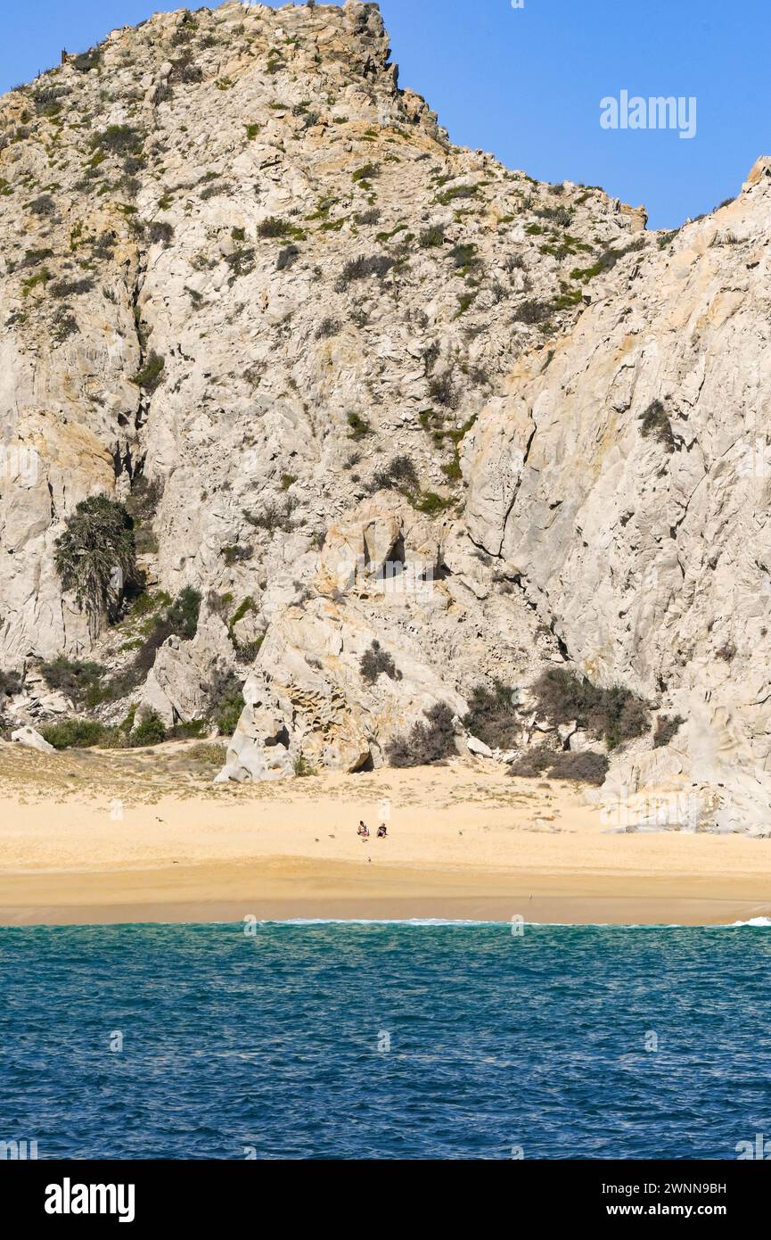 Cabo San Lucas, Mexico - 14 January 2024: Two people sitting on a ...