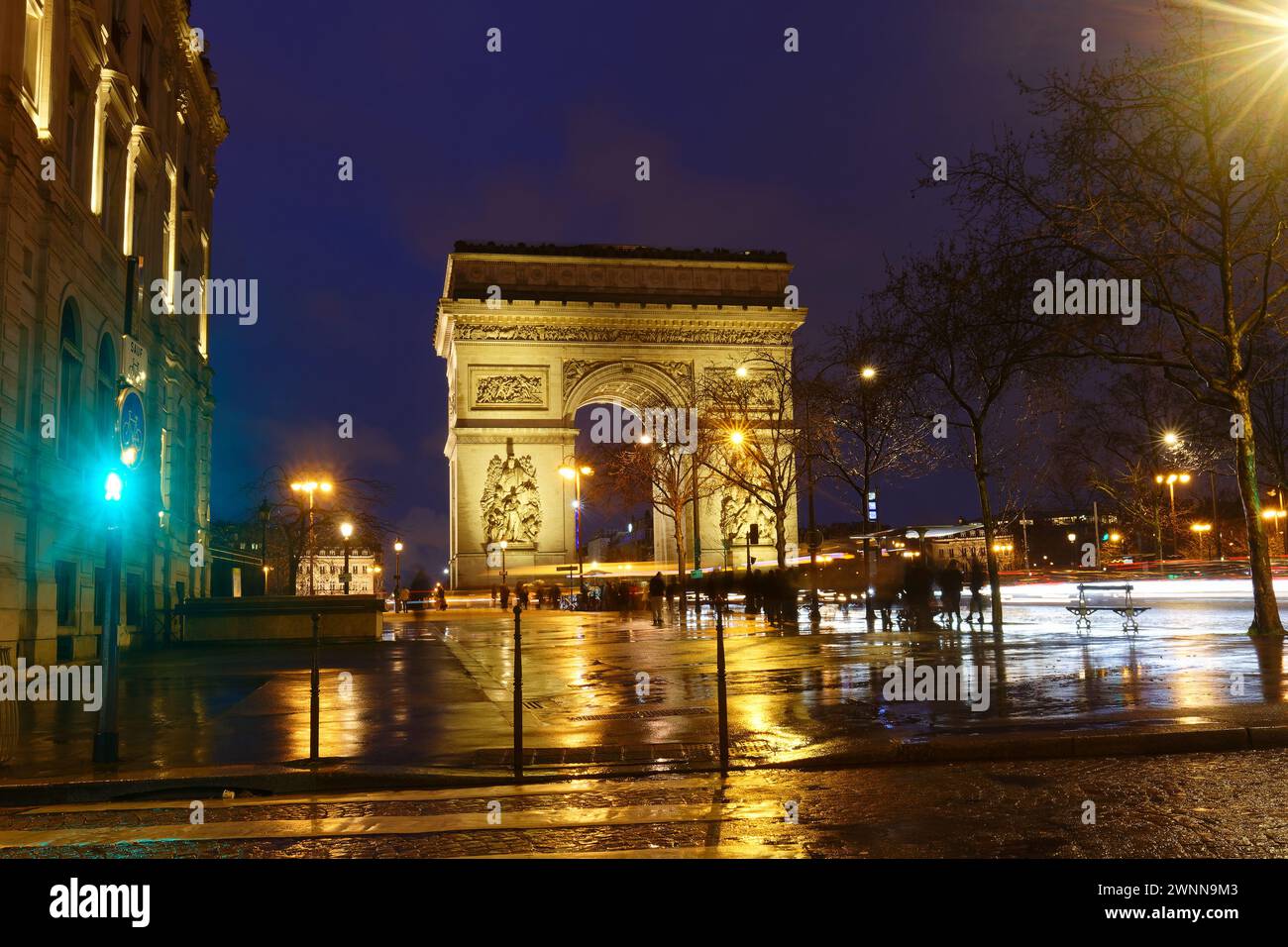 The Triumphal Arch in rainy evening. It is one of the most famous ...