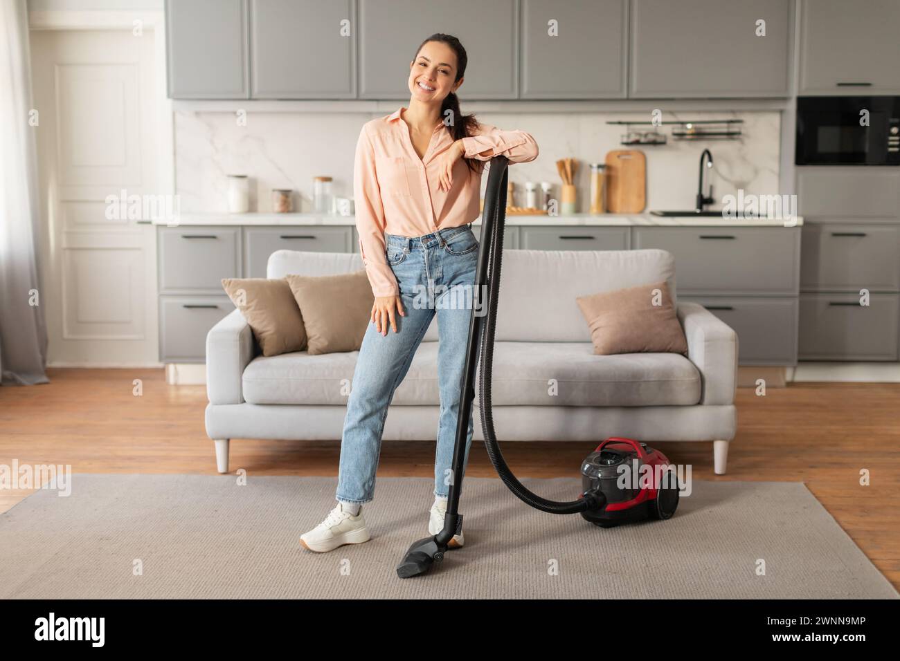 Woman posing vacuum cleaner hi-res stock photography and images - Alamy