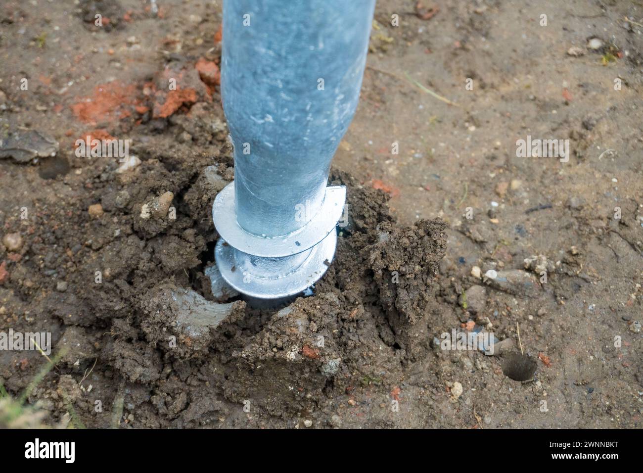 Closeup of iron support on a wooden pillar on the construction site ...