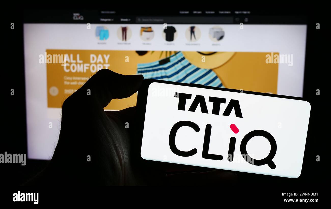 Person holding mobile phone with logo of Indian e-commerce marketplace ...