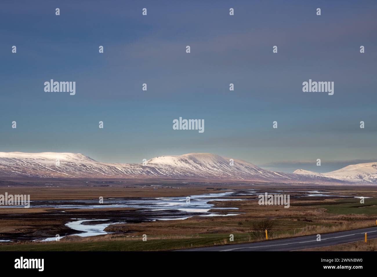 Big areas of fields and pastures. Mountains with snow in the background ...