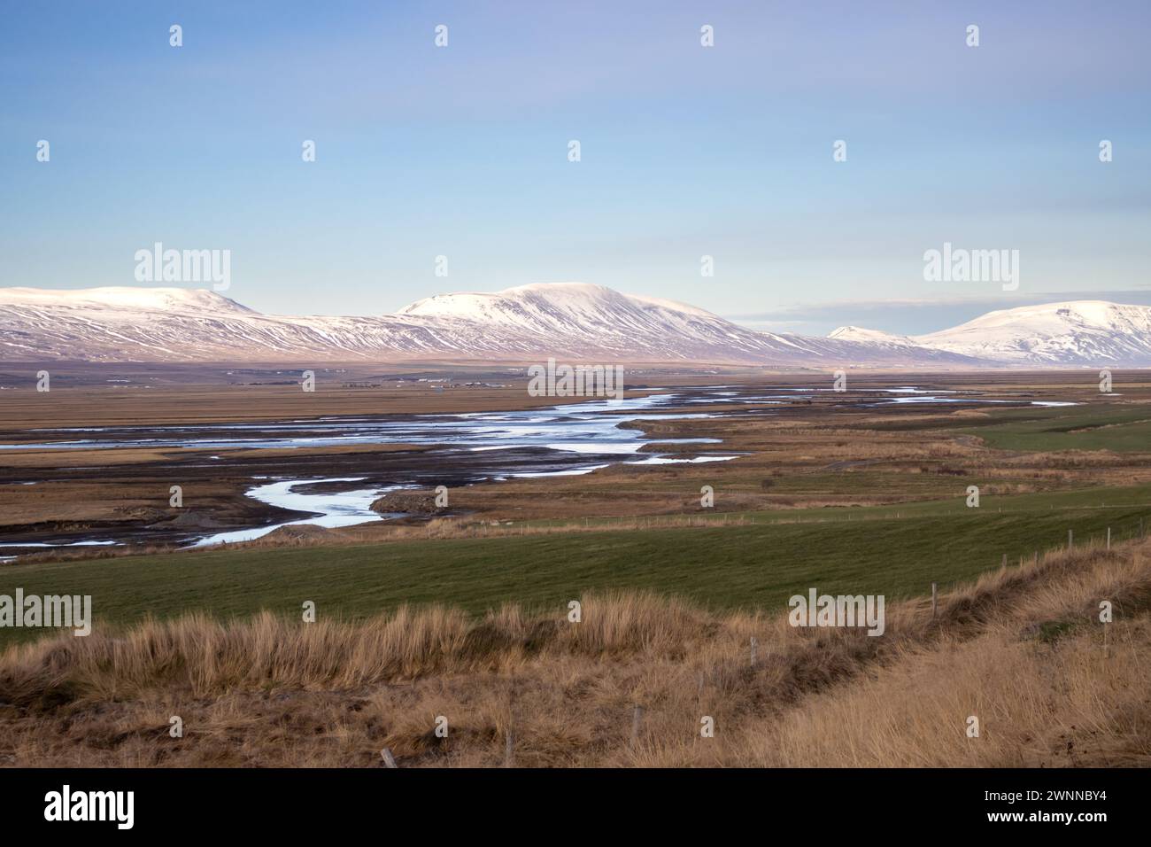Big areas of fields and pastures. Mountains with snow in the background ...
