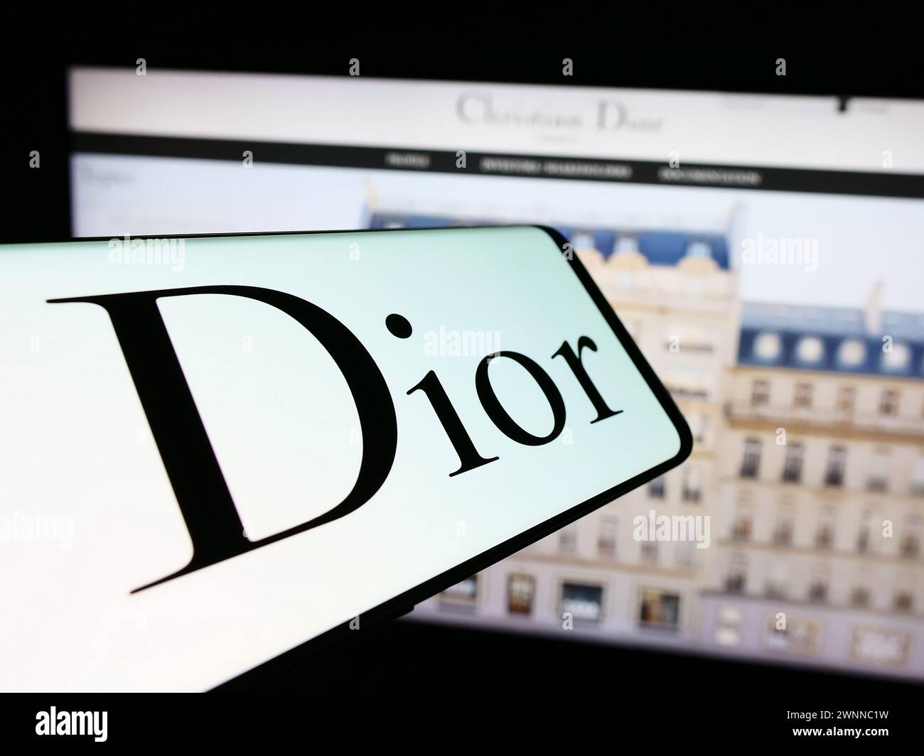 Mobile phone with logo of French luxury fashion company Christian Dior ...