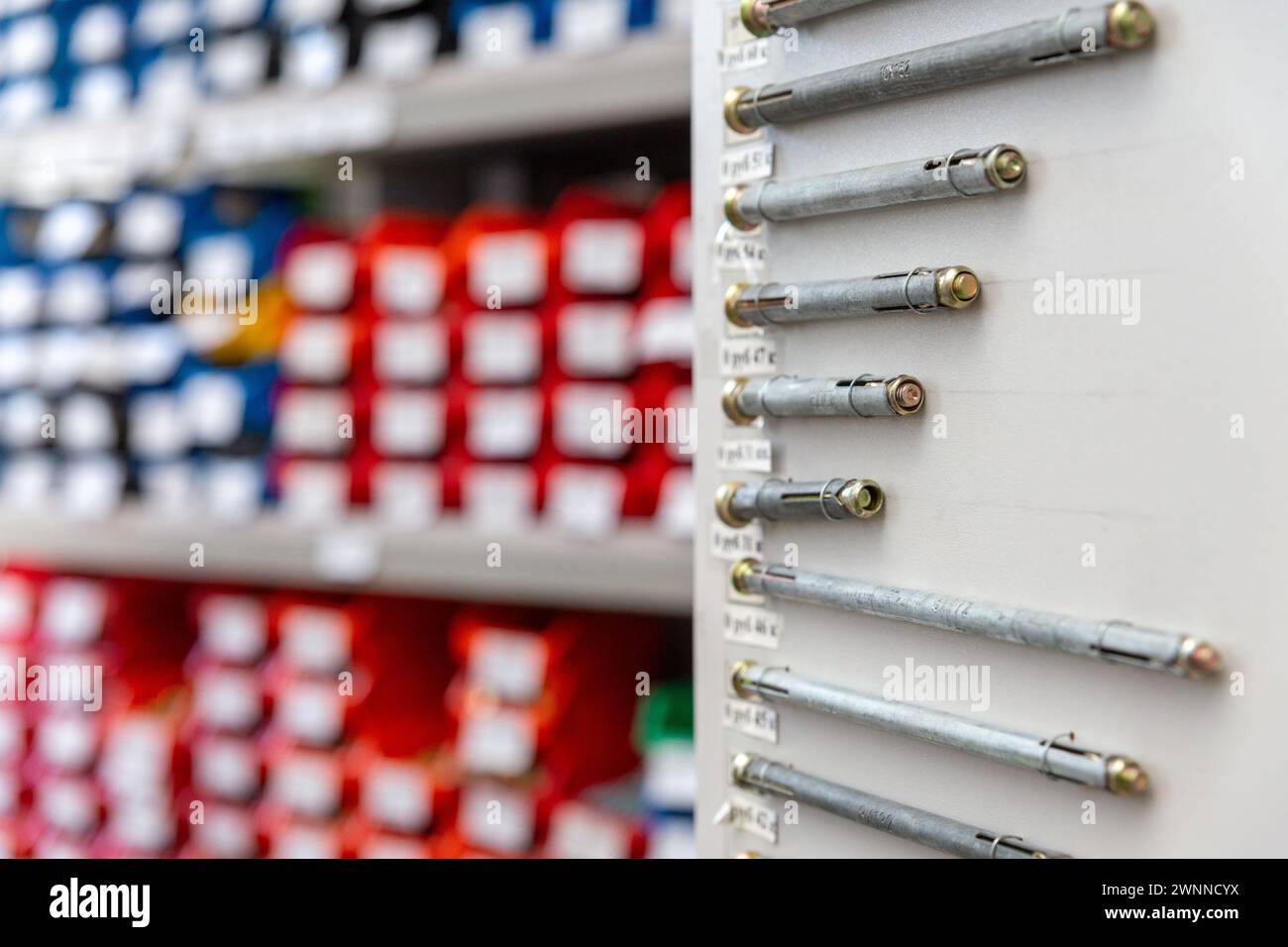 An assortment of anchors with sizes and prices on the stand in the ...