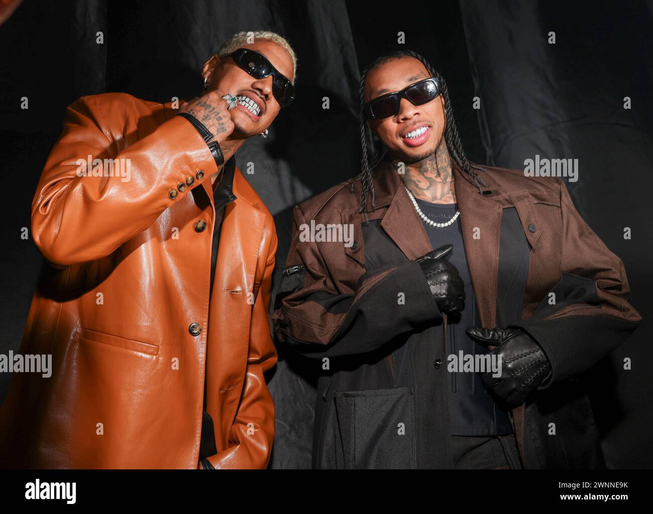 Alexander Edwards, left, and Tyga attend the Mugler Fall/Winter 2024 ...