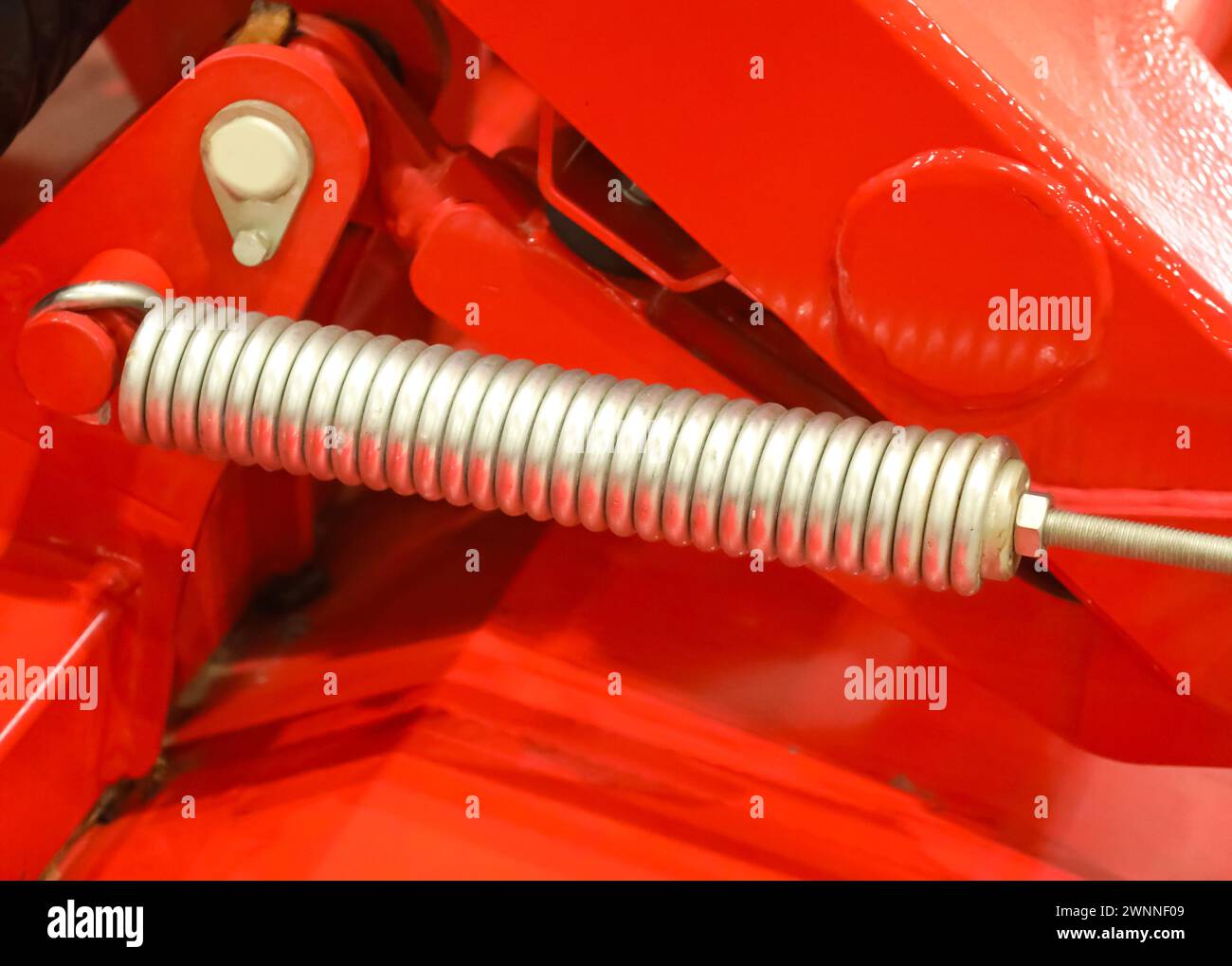 Unloaded steel spring ready for loading and tensioning in the machine ...