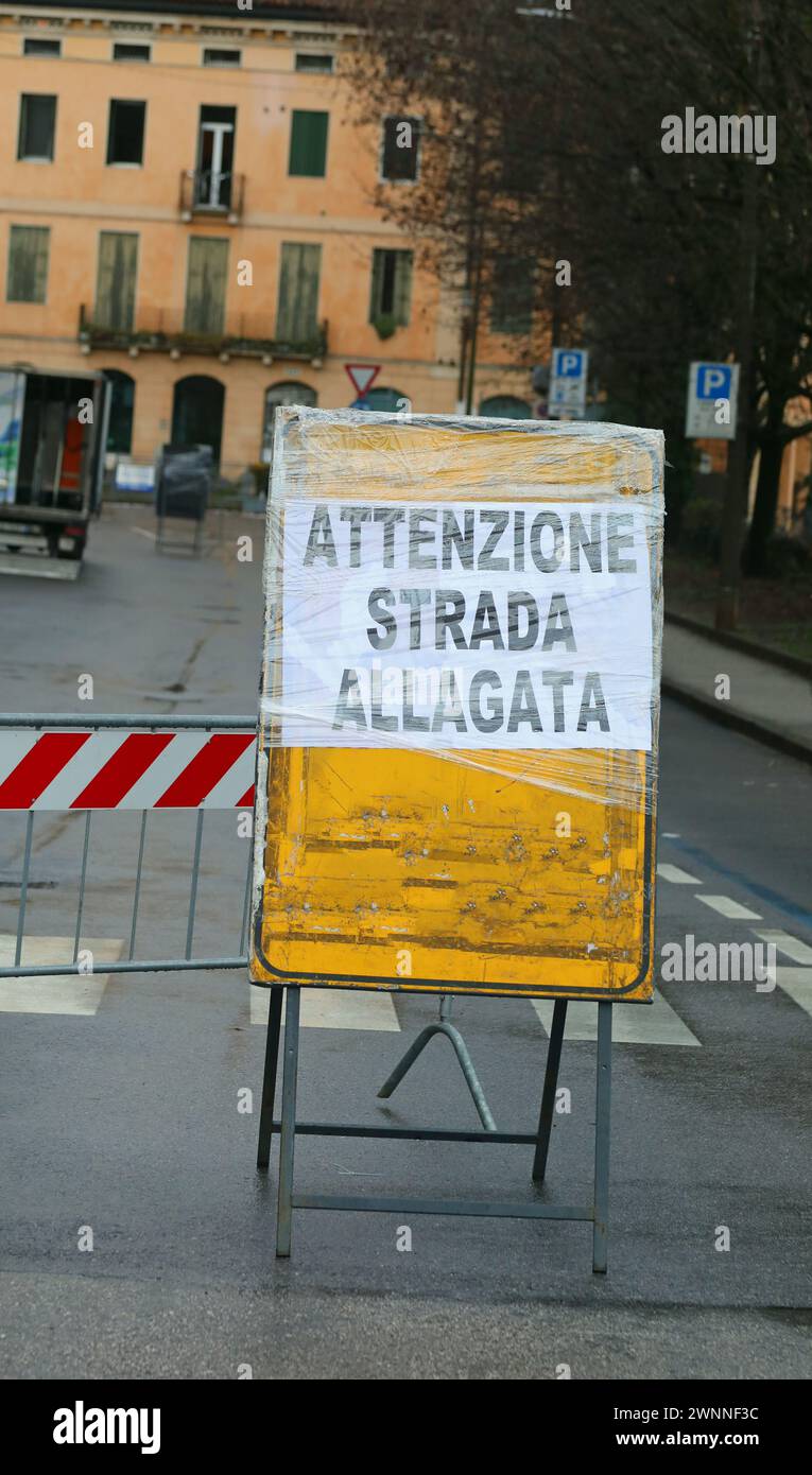 Large warning sign with big text in italian language that means CAUTION ...