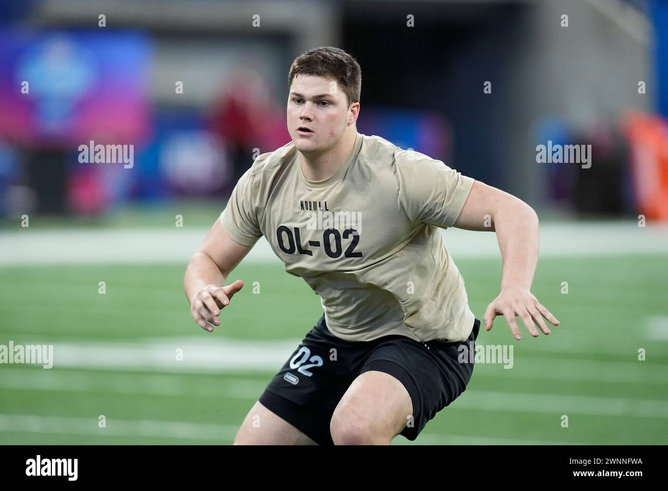 Notre Dame offensive lineman Joe Alt runs a drill at the NFL football ...