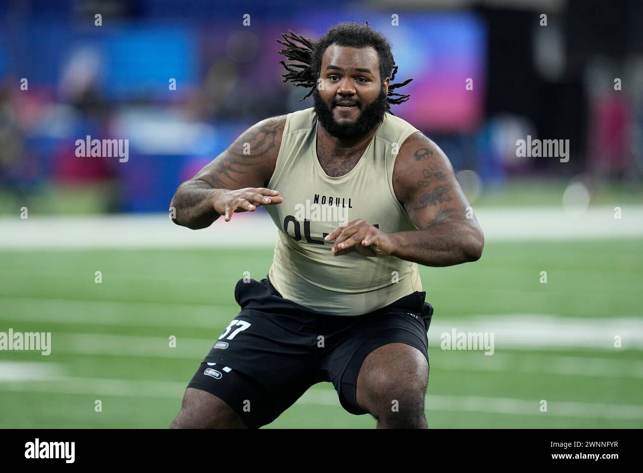 Michigan offensive lineman Trente Jones runs a drill at the NFL ...