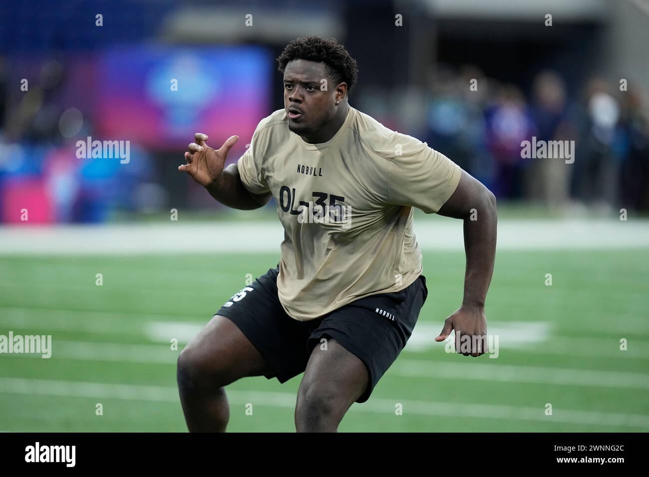 Texas offensive lineman Christian Jones runs a drill at the NFL ...