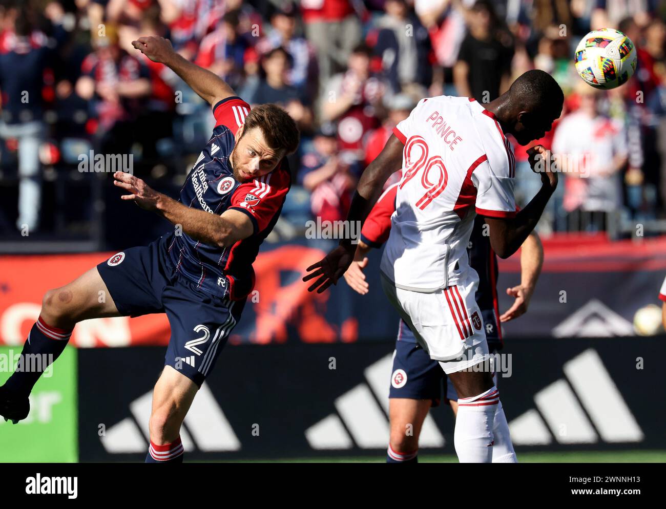 New England Revolution defender Dave Romney (2) and Toronto FC forward ...