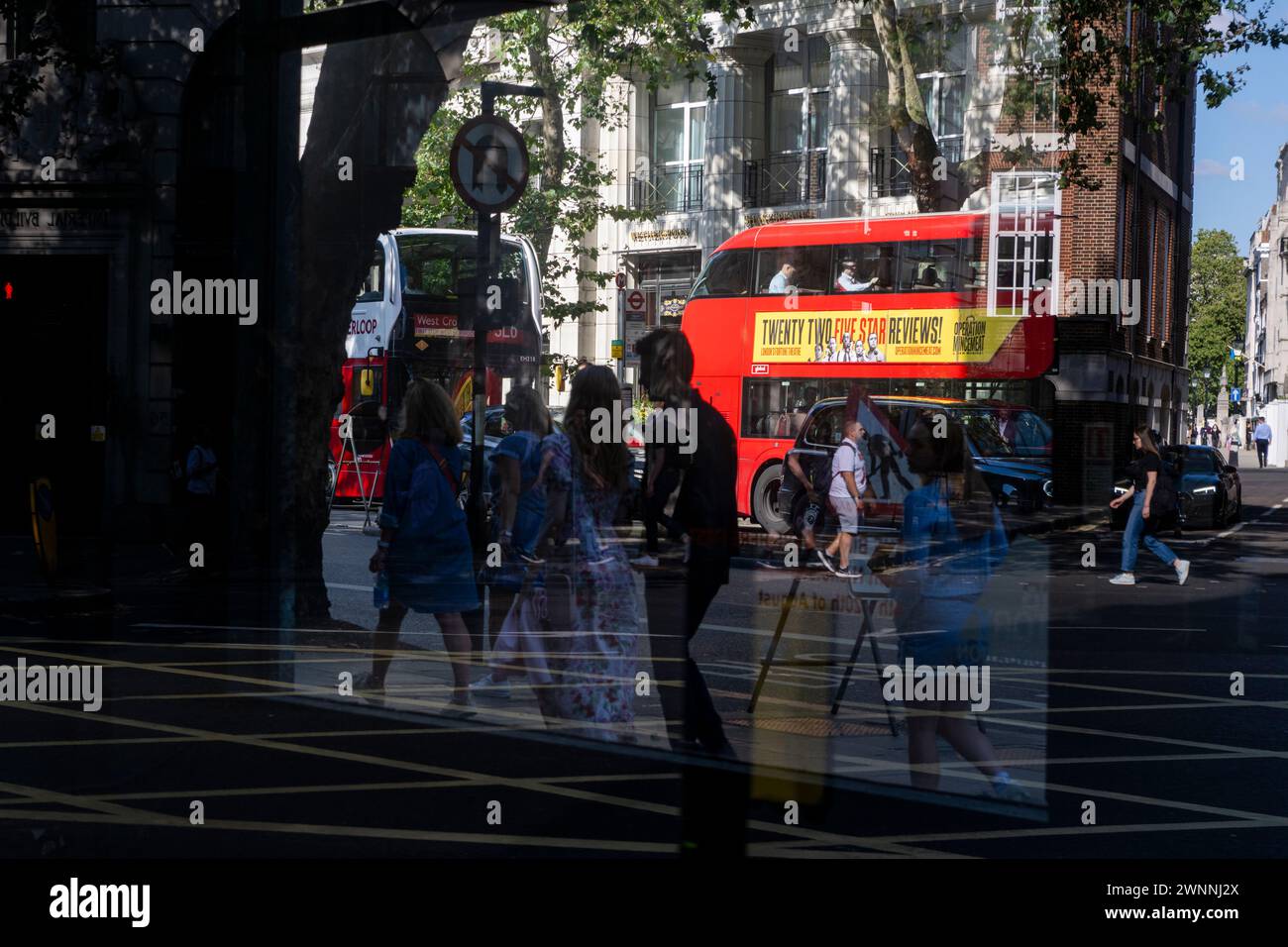 Reflection in a shop window corner of Great Queen Street and Kingsway ...