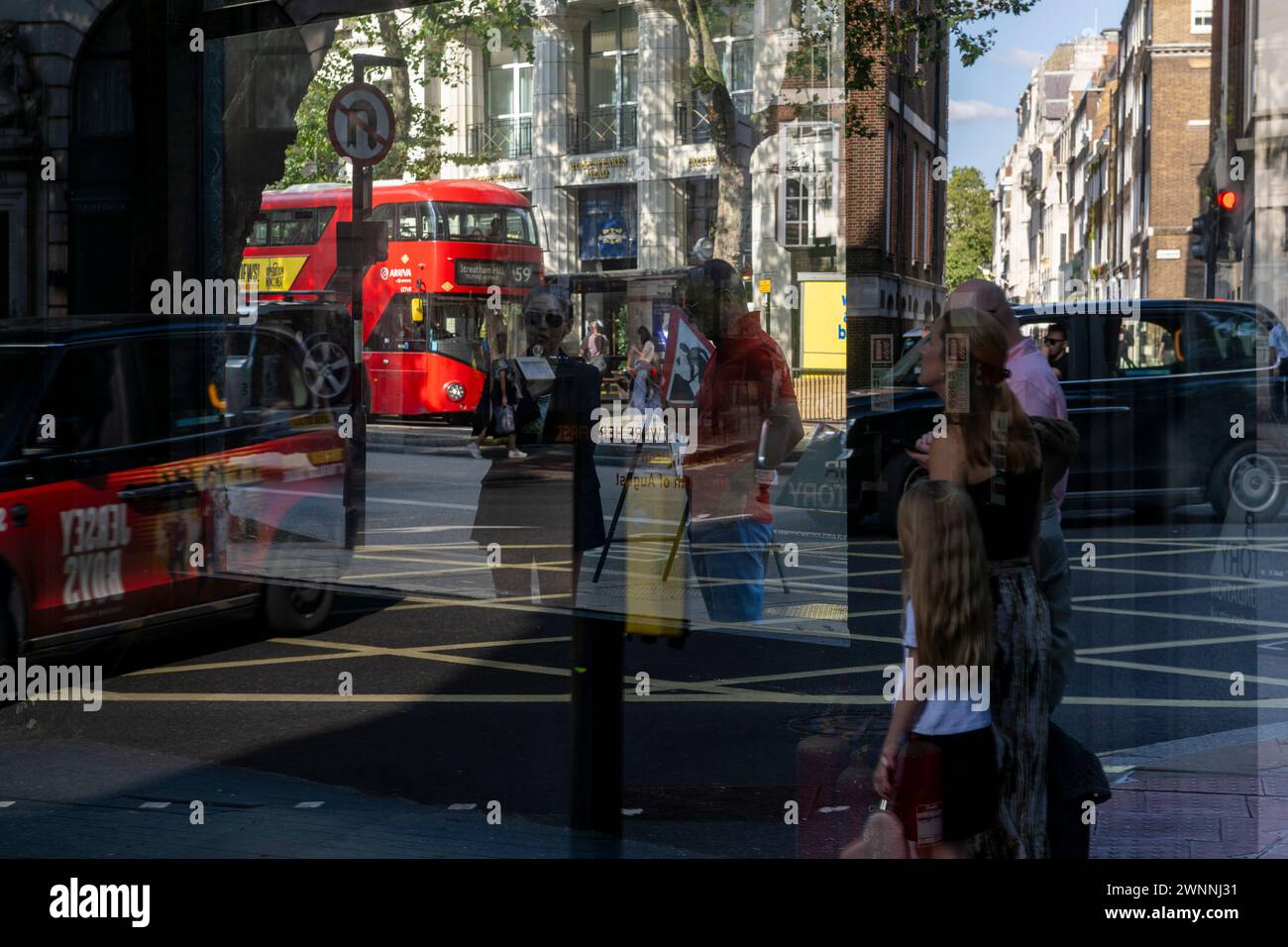 Reflection in a shop window corner of Great Queen Street and Kingsway ...