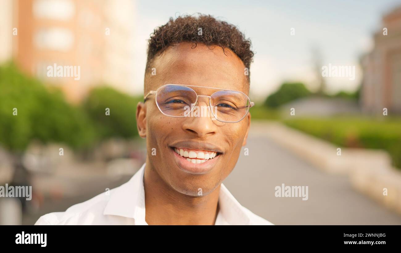 Black man looks camera smiles hi-res stock photography and images - Alamy