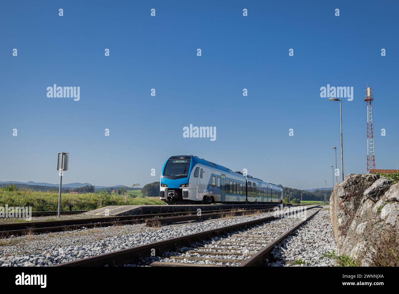 Modern blue and white passenger train, diesel multiple unit is waiting ...