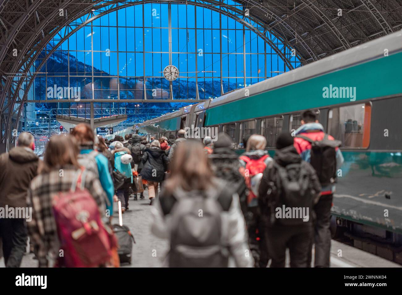 Crowd of people is rushing towards the first morning train from Bergen ...