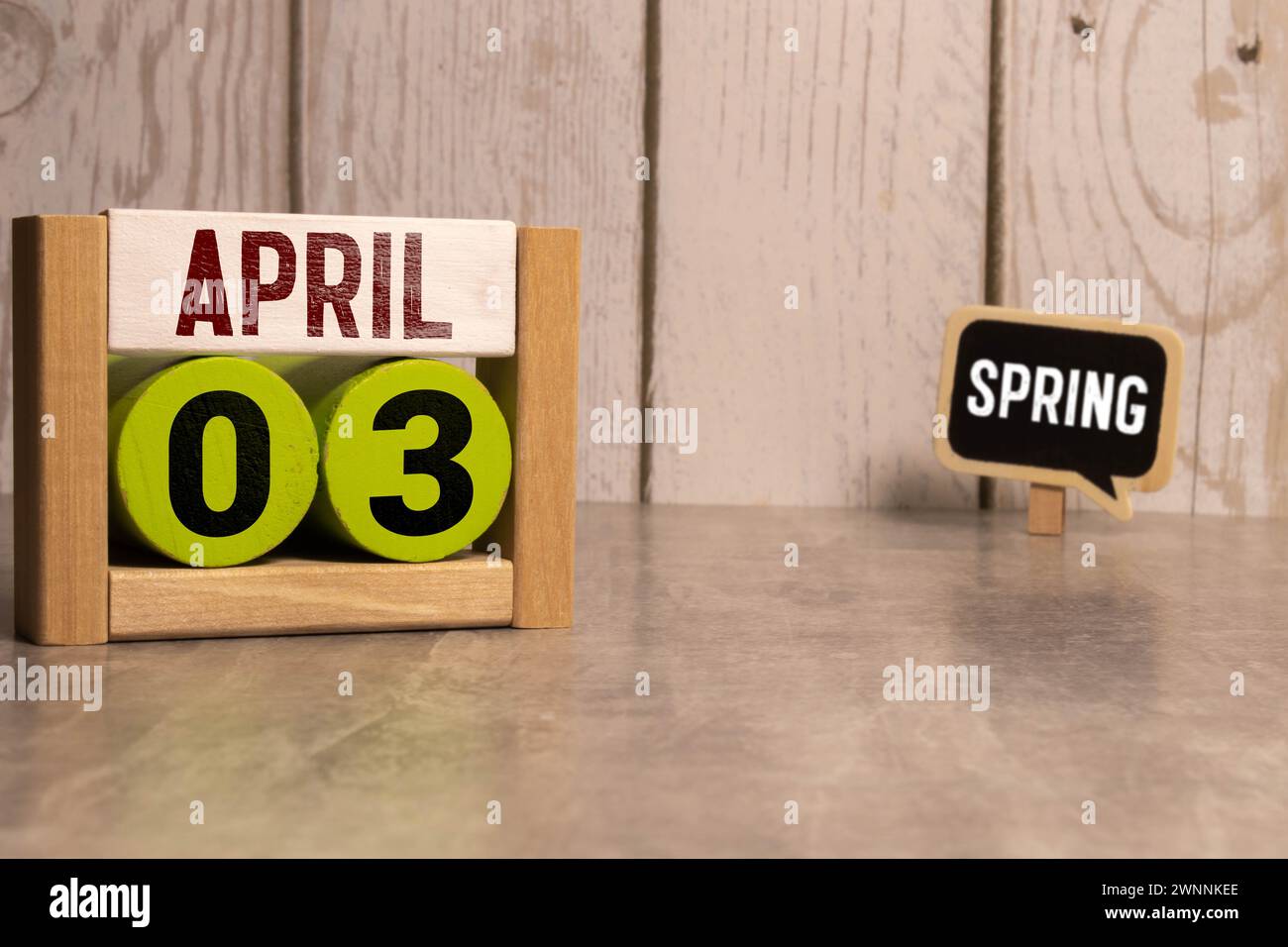 April 3rd. Day 3 of april month, calendar on table with yellow ...