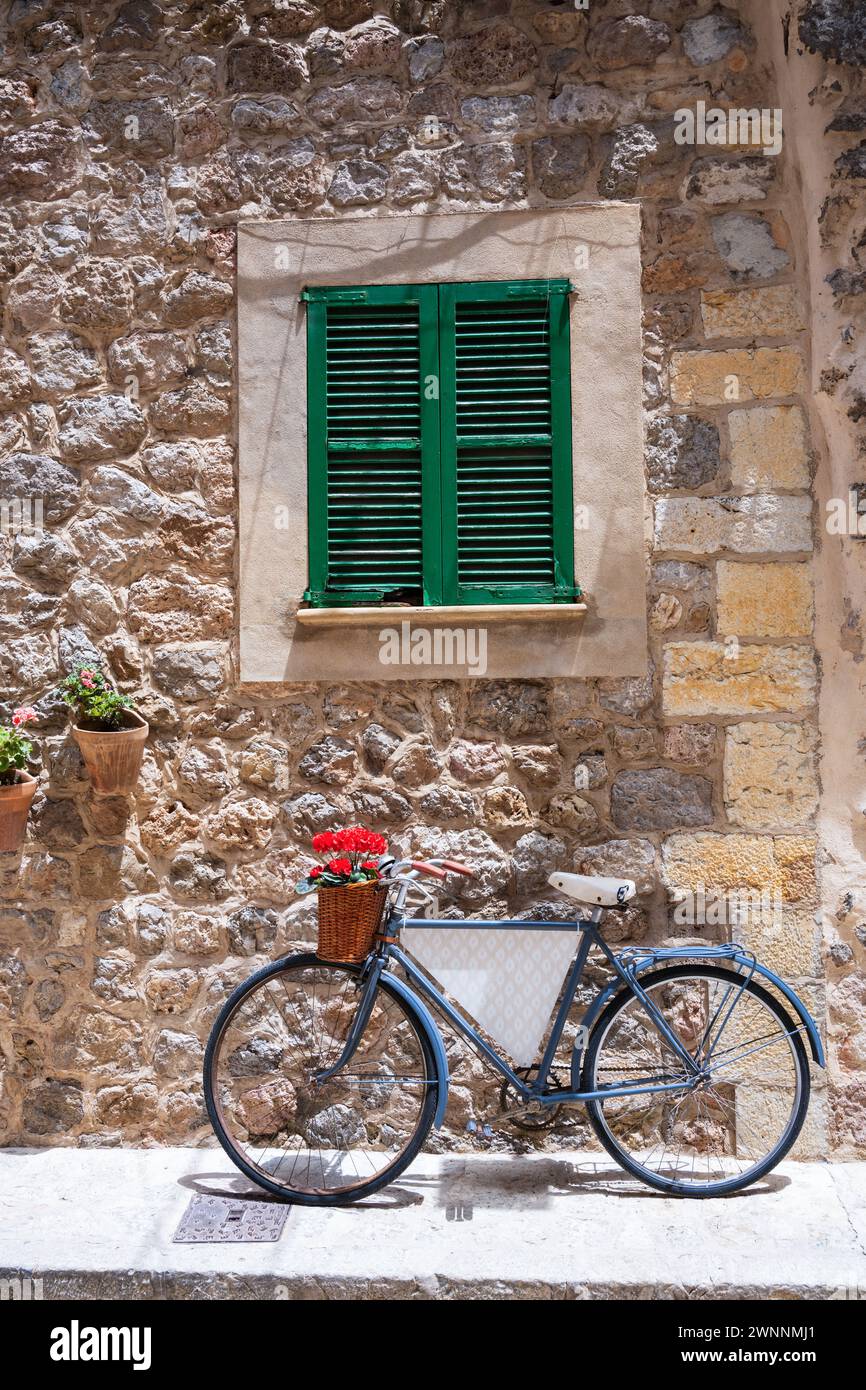 Bike Under Window Stock Photo - Alamy