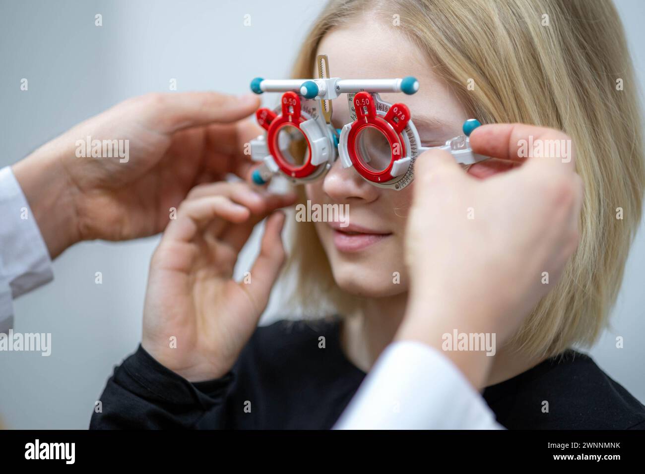 portrait happy little girl patient ophthalmology clinic, vision test in ...
