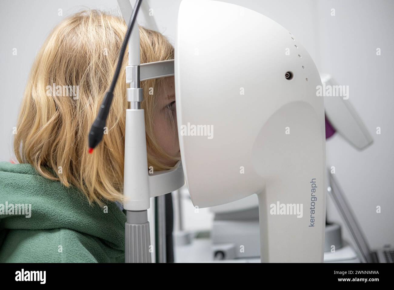 side view little girl patient ophthalmology clinic, vision test on ...