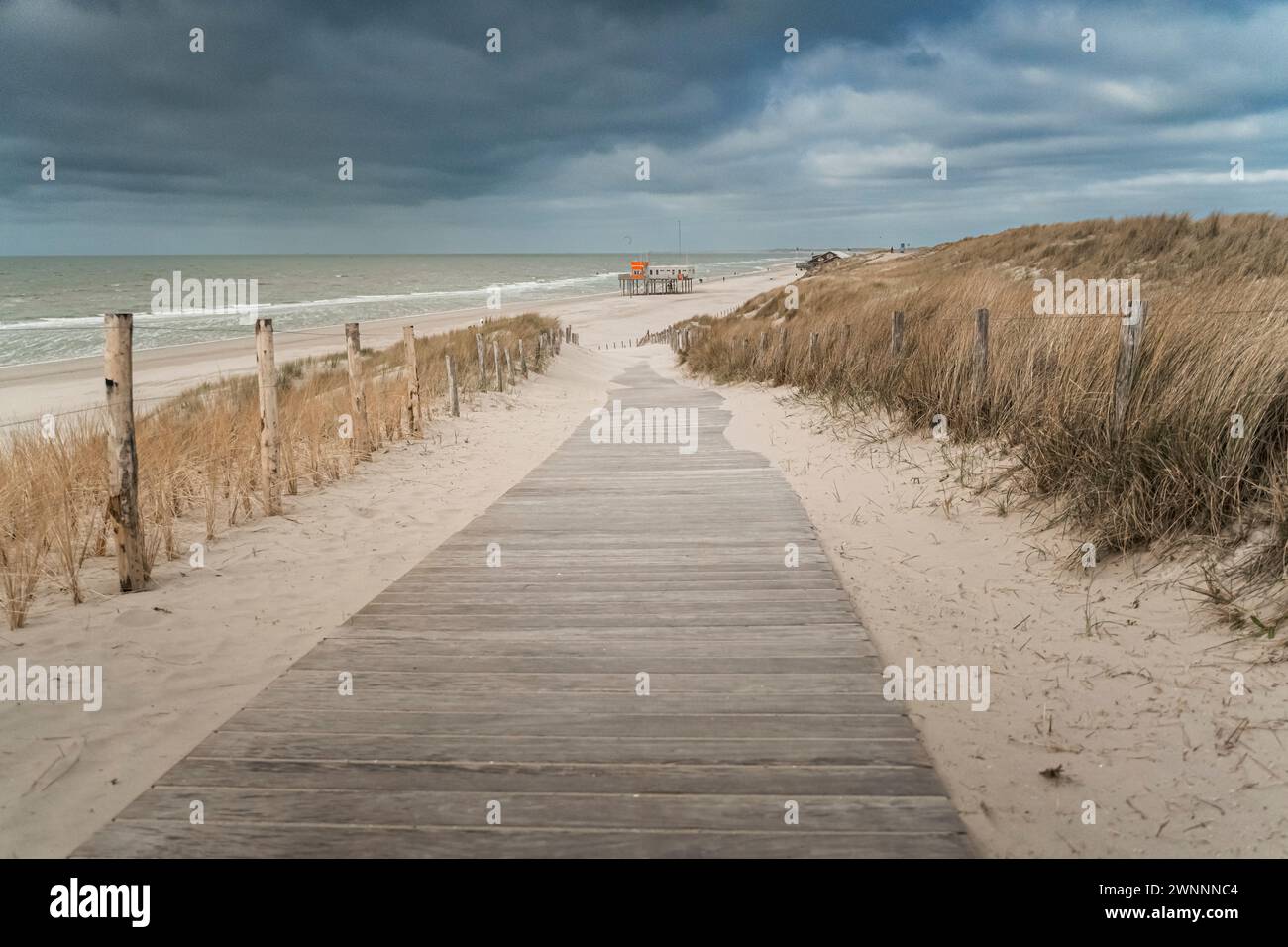 Beach landscape, Sand and sea under dark grey cloudy clouds in sky, The ...