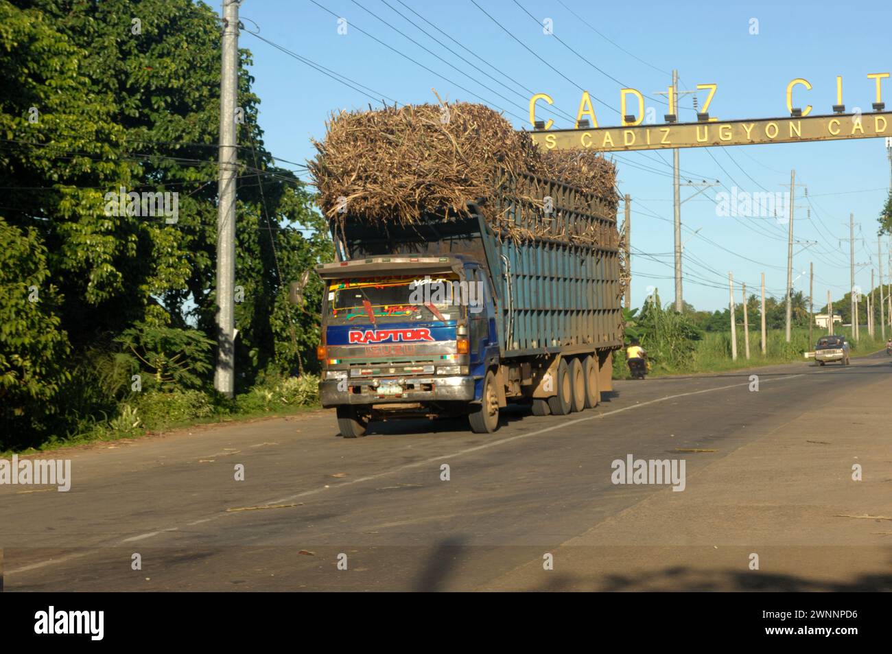 Overloaded trucks carrying sugarcane crop on road from Cadiz City to ...