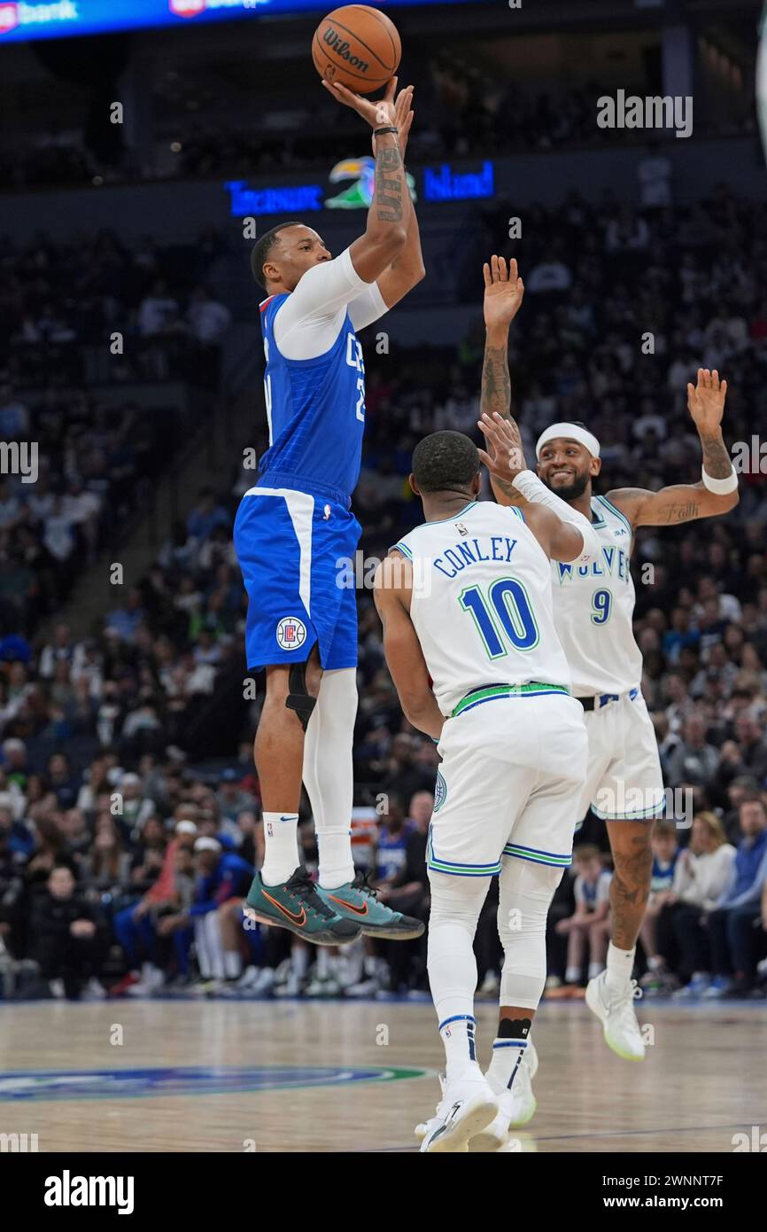 Los Angeles Clippers guard Norman Powell, left, goes up to shoot over ...