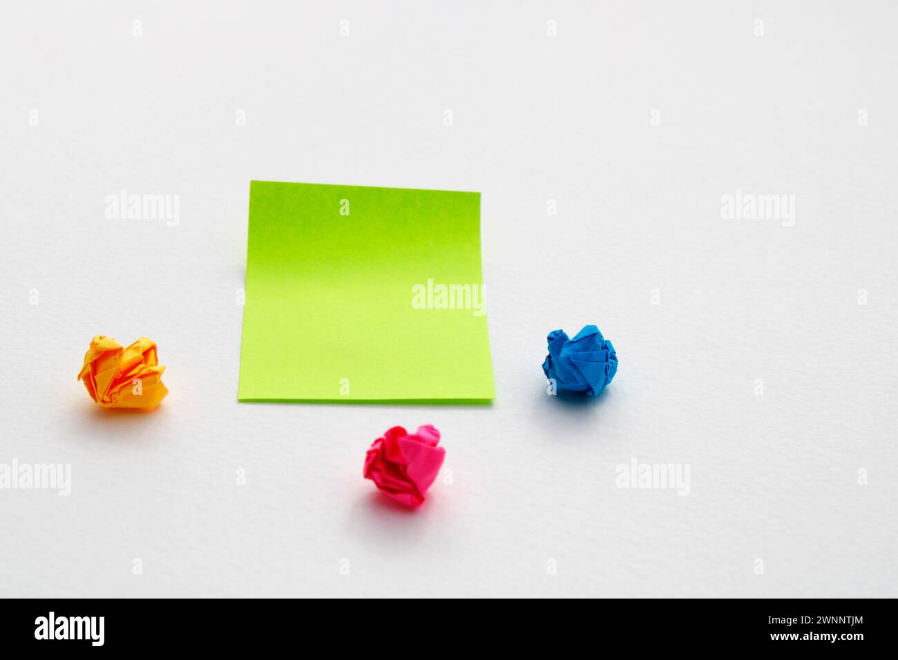 Green note with others around it crumpled and discarded Stock Photo - Alamy